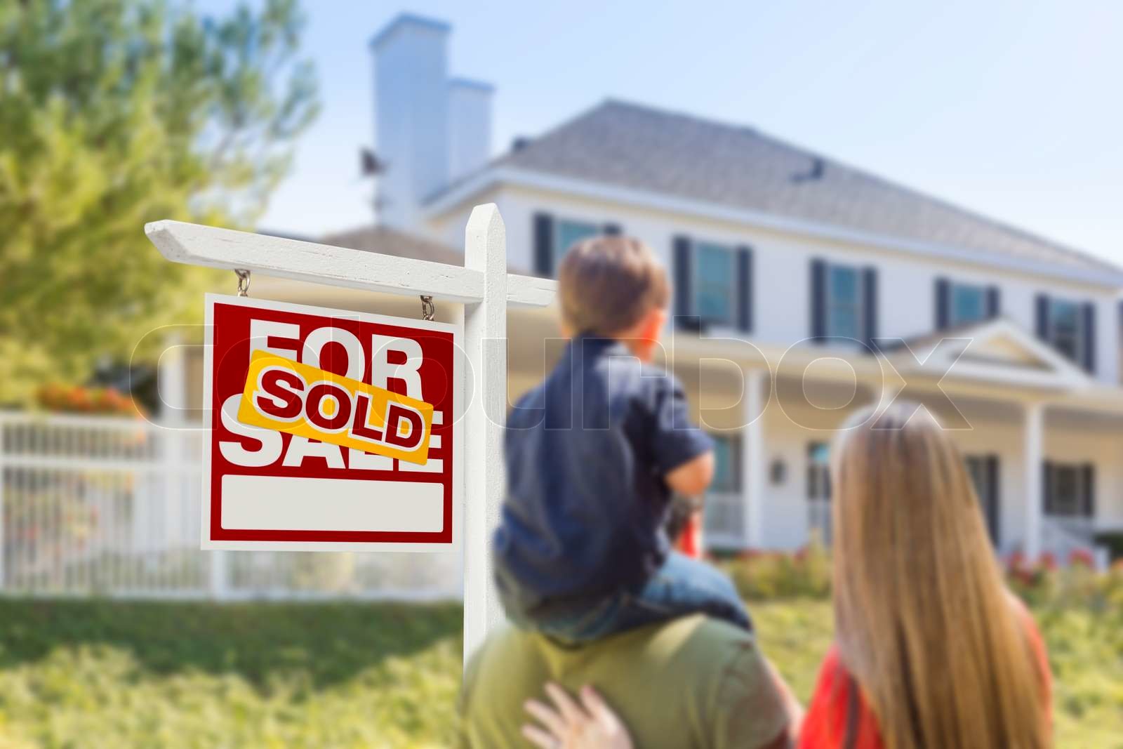 Family Facing Sold For Sale Real Estate Sign and House | Stock image ...