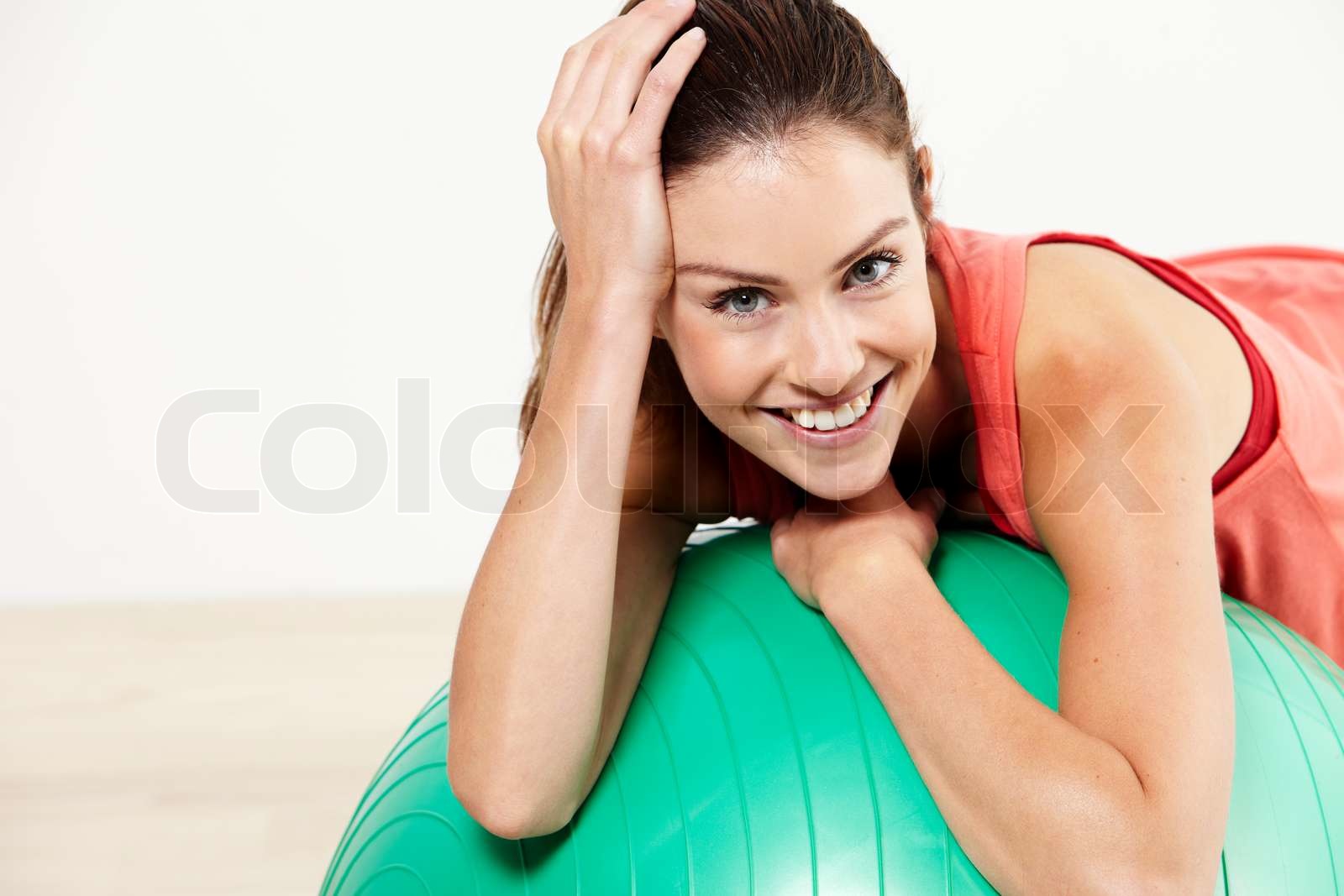 young woman relaxing on a pilates ball | Stock image | Colourbox