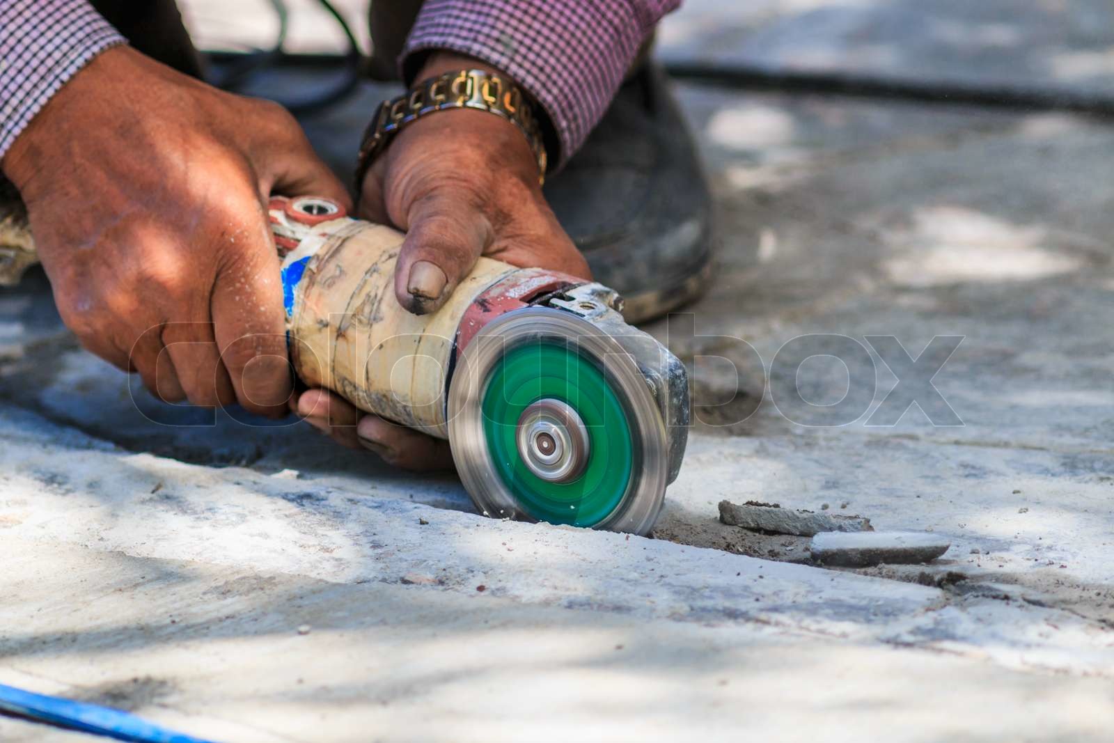 Construction workers grinding | Stock image | Colourbox