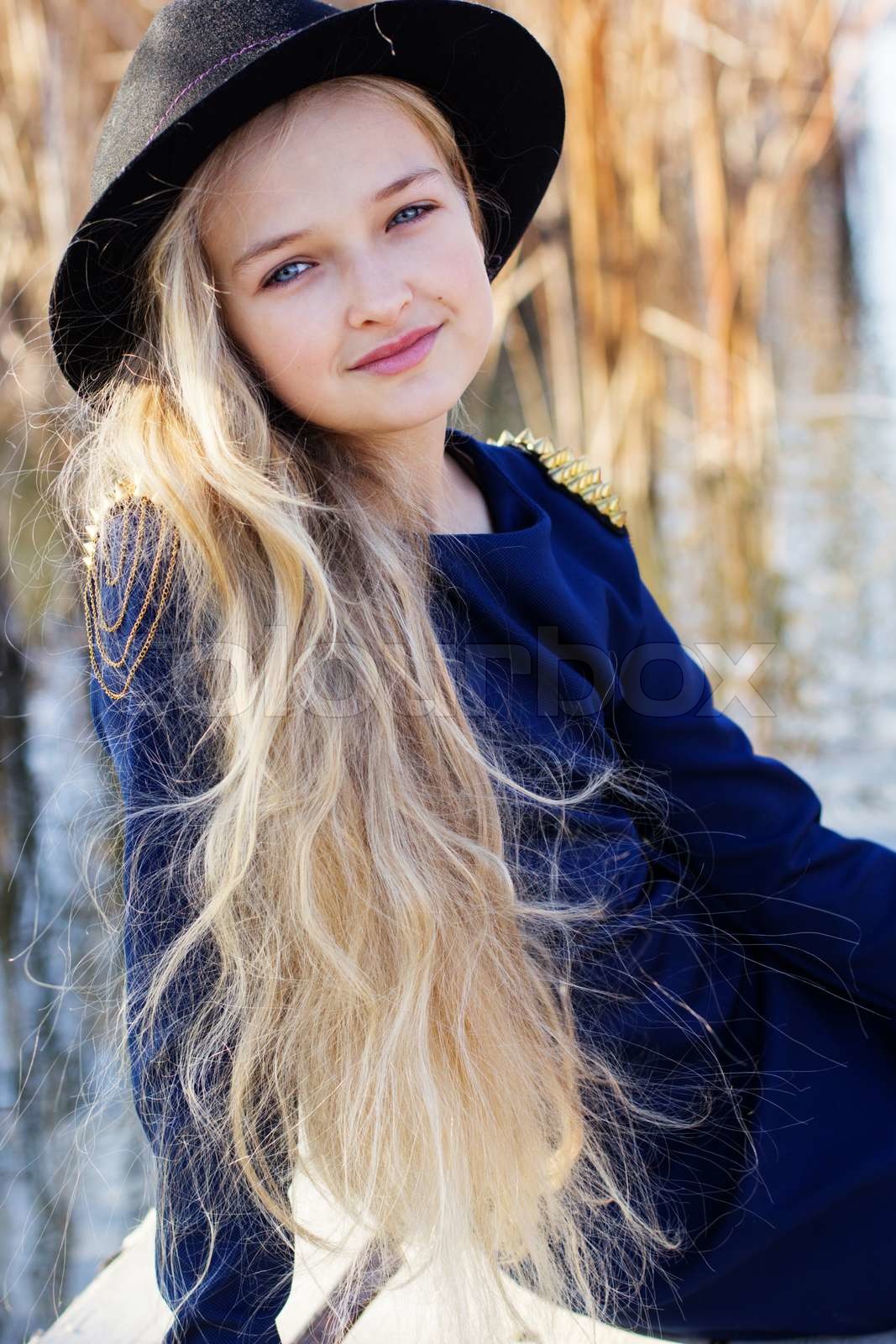 Cute fashion little girl is resting near lake | Stock image | Colourbox