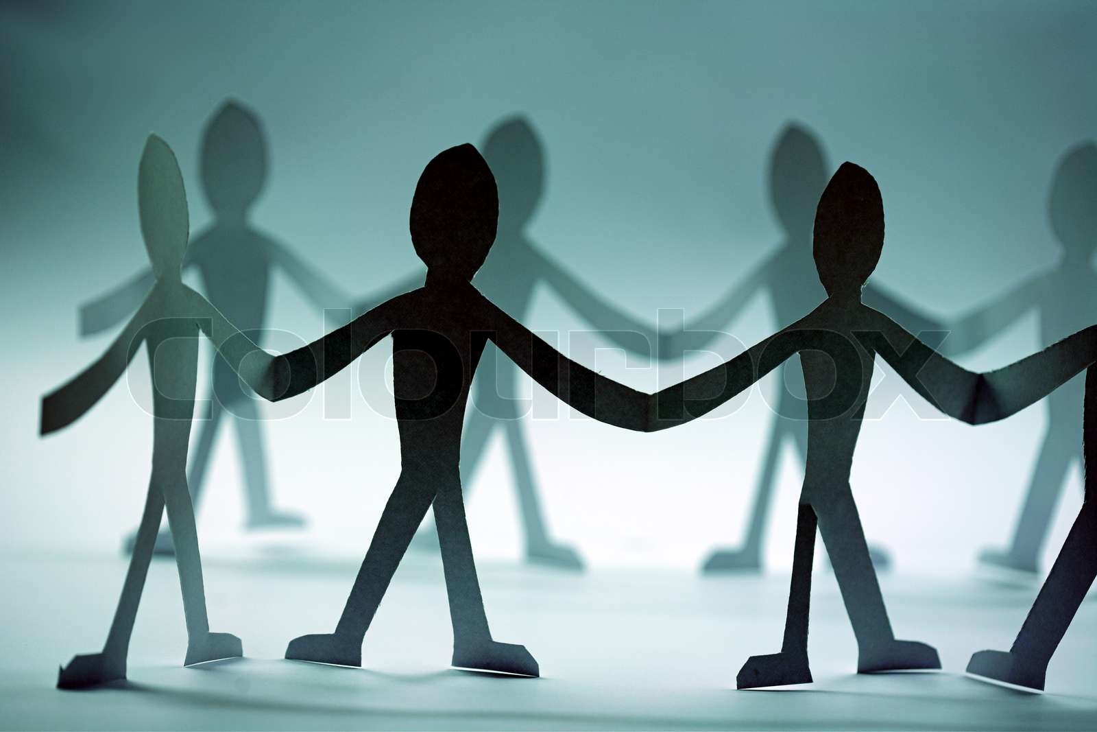 small rudimentary figures of man in paper | Stock image | Colourbox