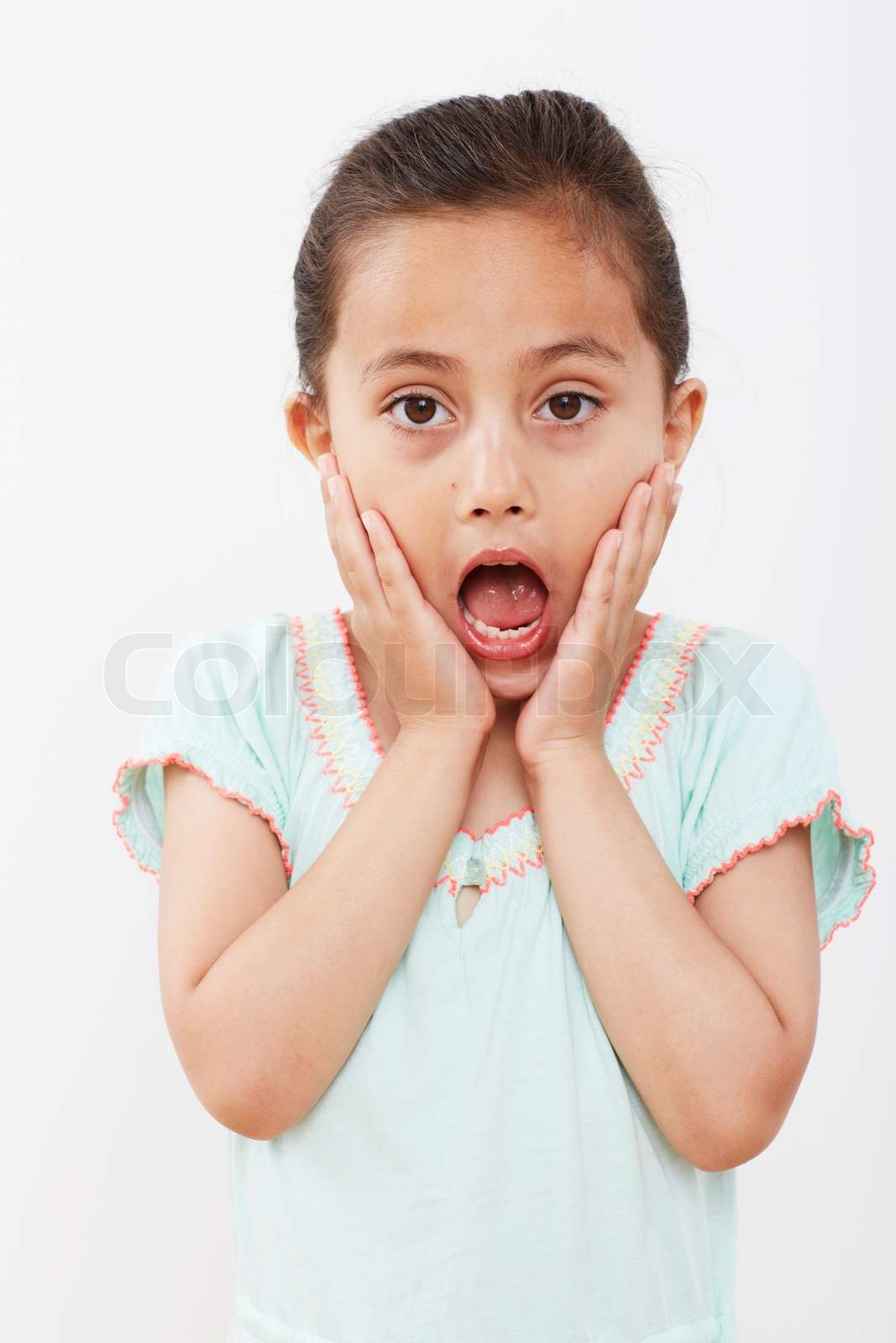 Young girl looking shocked, portrait | Stock image | Colourbox
