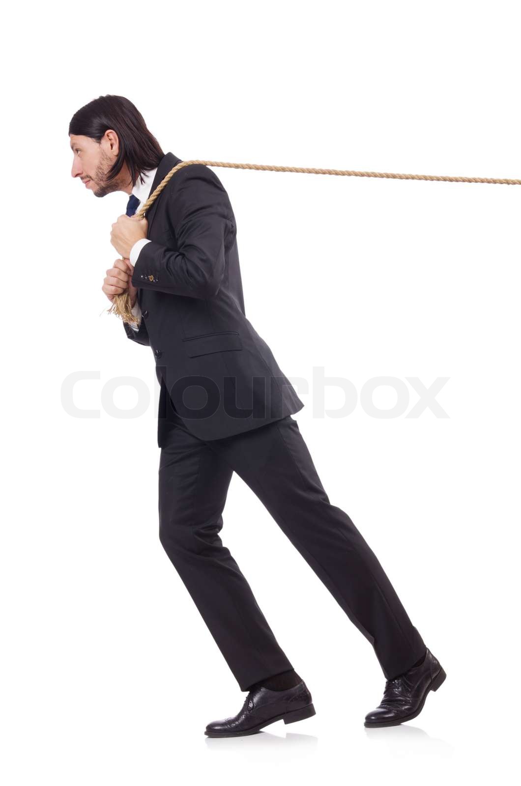Young businessman pulling rope isolated on white | Stock image | Colourbox