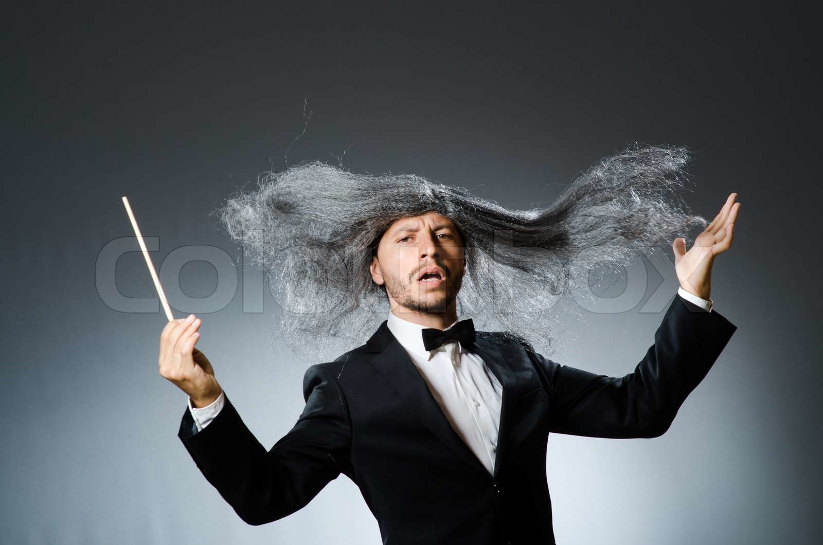 Funny conductor with long grey hair | Stock image | Colourbox