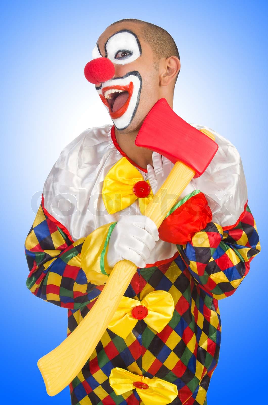 Clown with axe isolated on white | Stock image | Colourbox