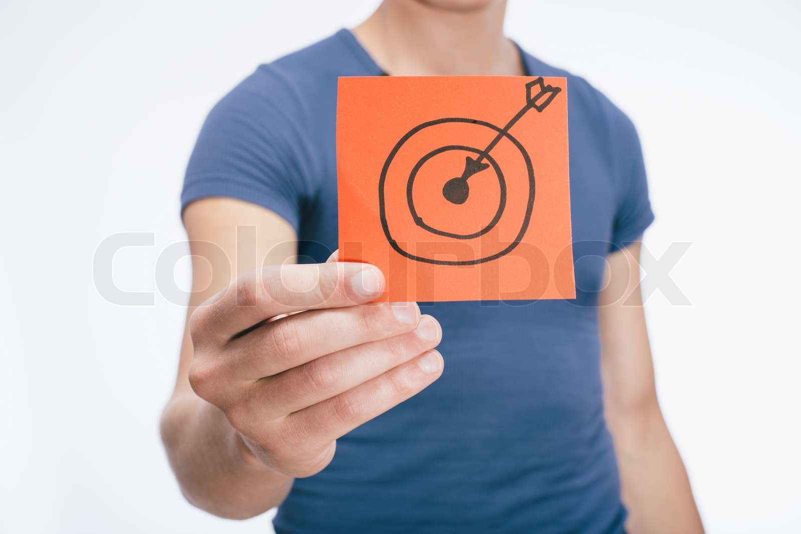 drawing a picture in his hand target | Stock image | Colourbox