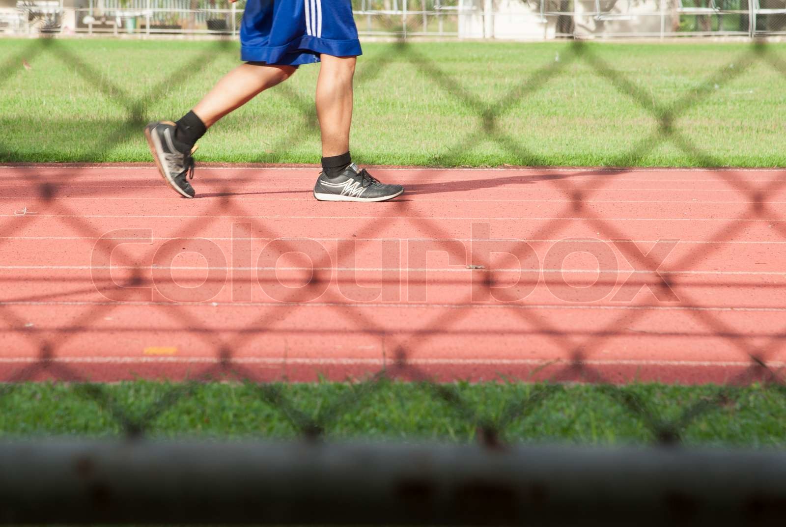running in stadium at sunset | Stock image | Colourbox