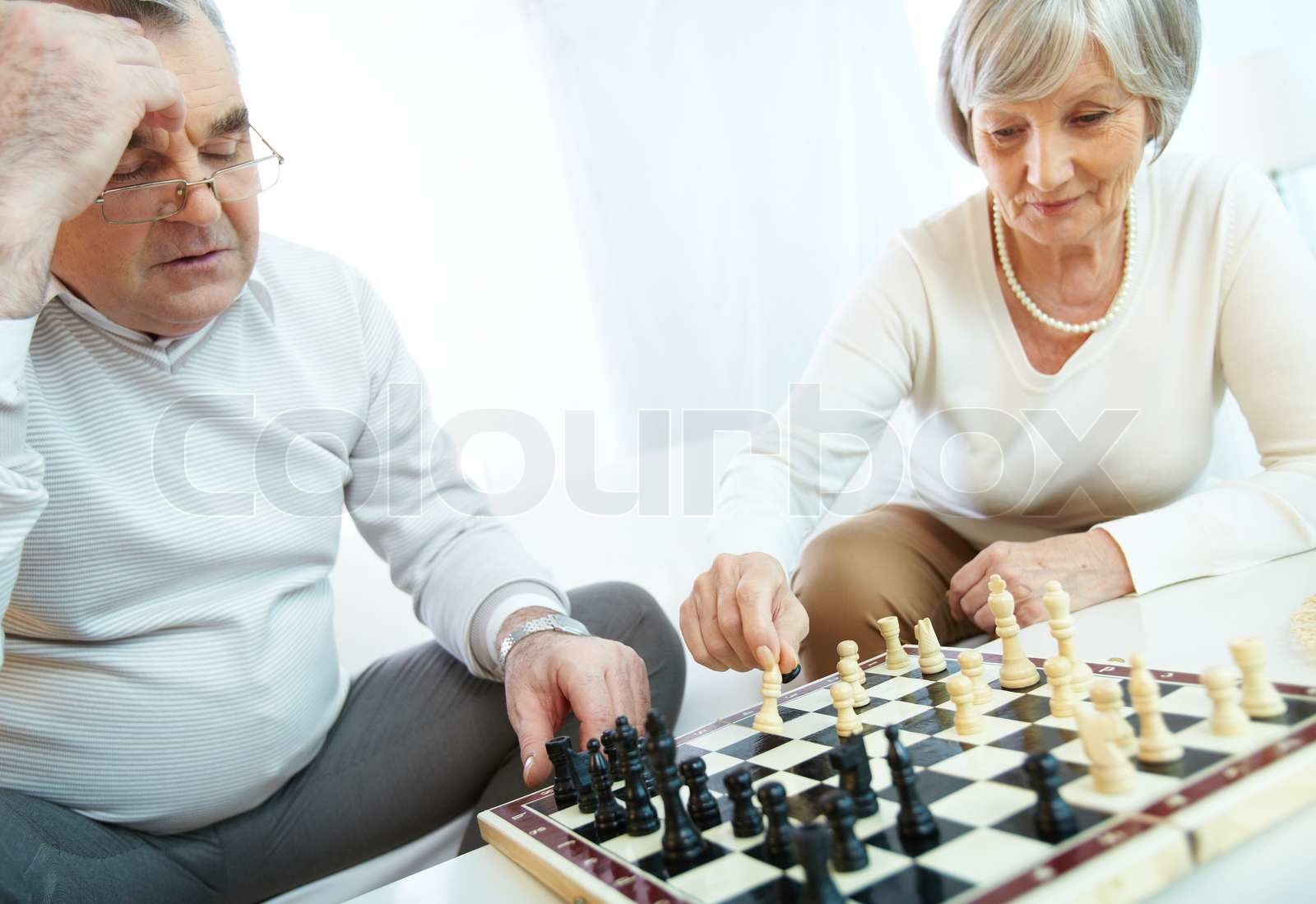 Seniors playing chess | Stock image | Colourbox