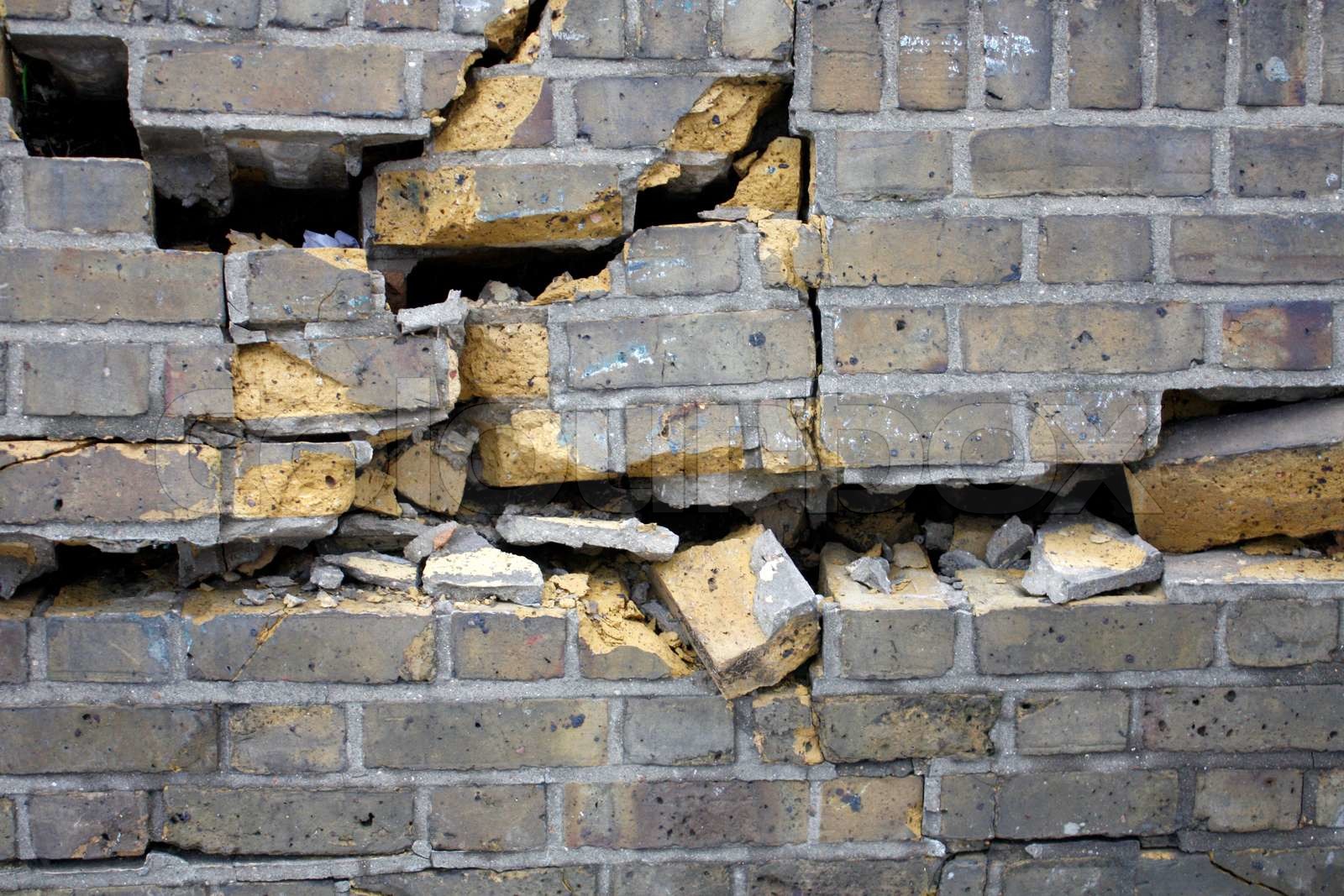 Destroyed brick wall | Stock image | Colourbox