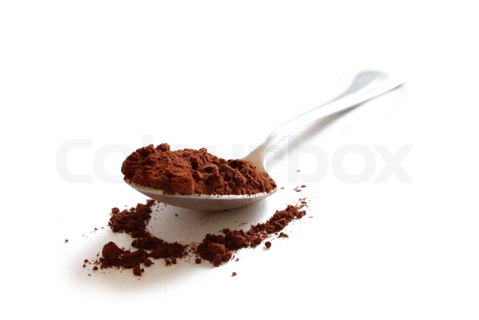 Cocoa powder on spoon | Stock image | Colourbox