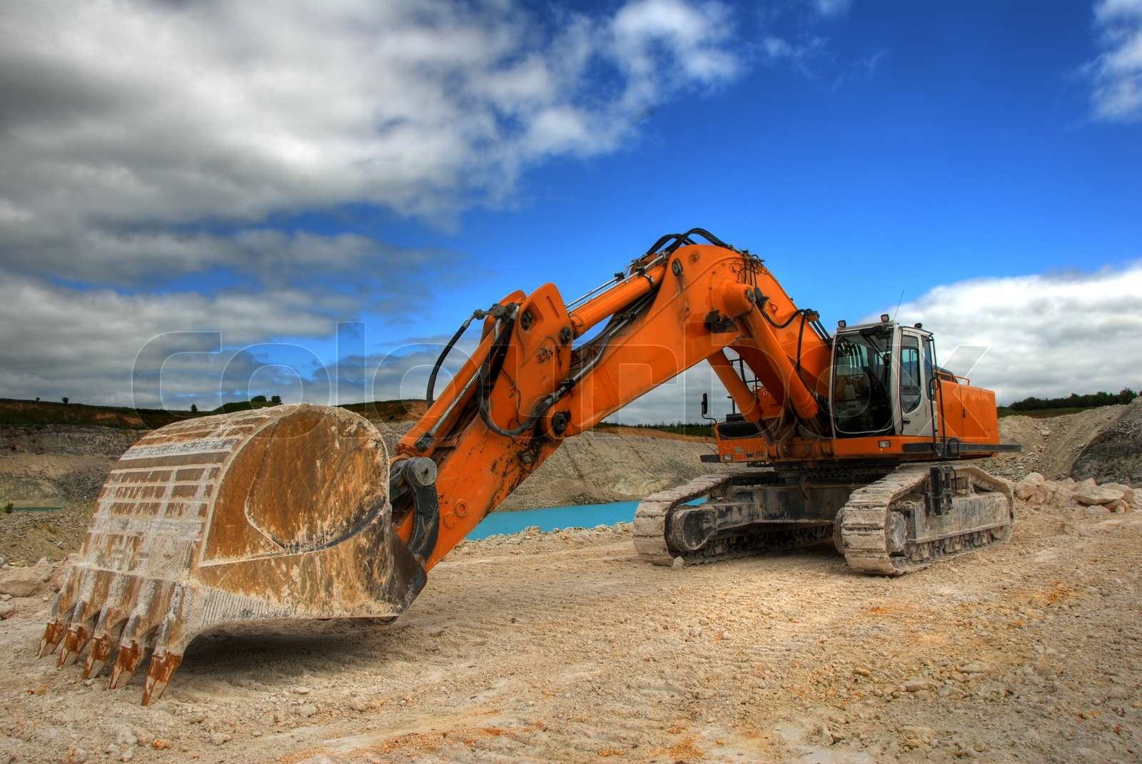 Excavator in a limestone quarry | Stock image | Colourbox