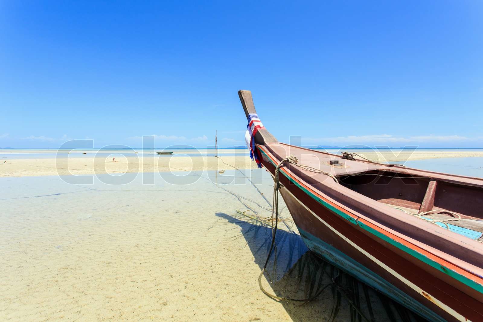 Traditional Thai boat or long tail boat stand at the beach | Stock ...