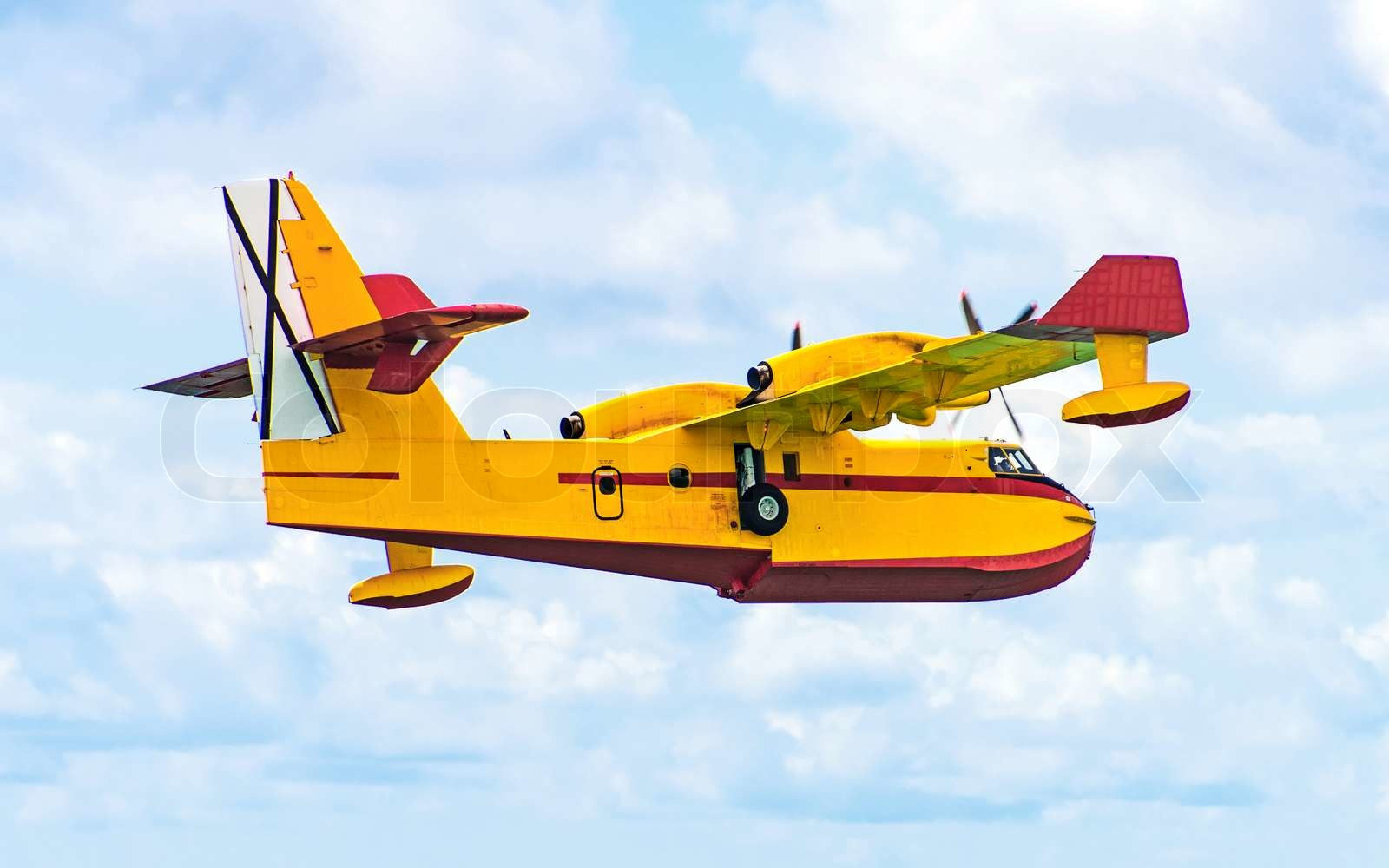 Aerial firefighting. Aircraft preparing to collect sea water. | Stock ...
