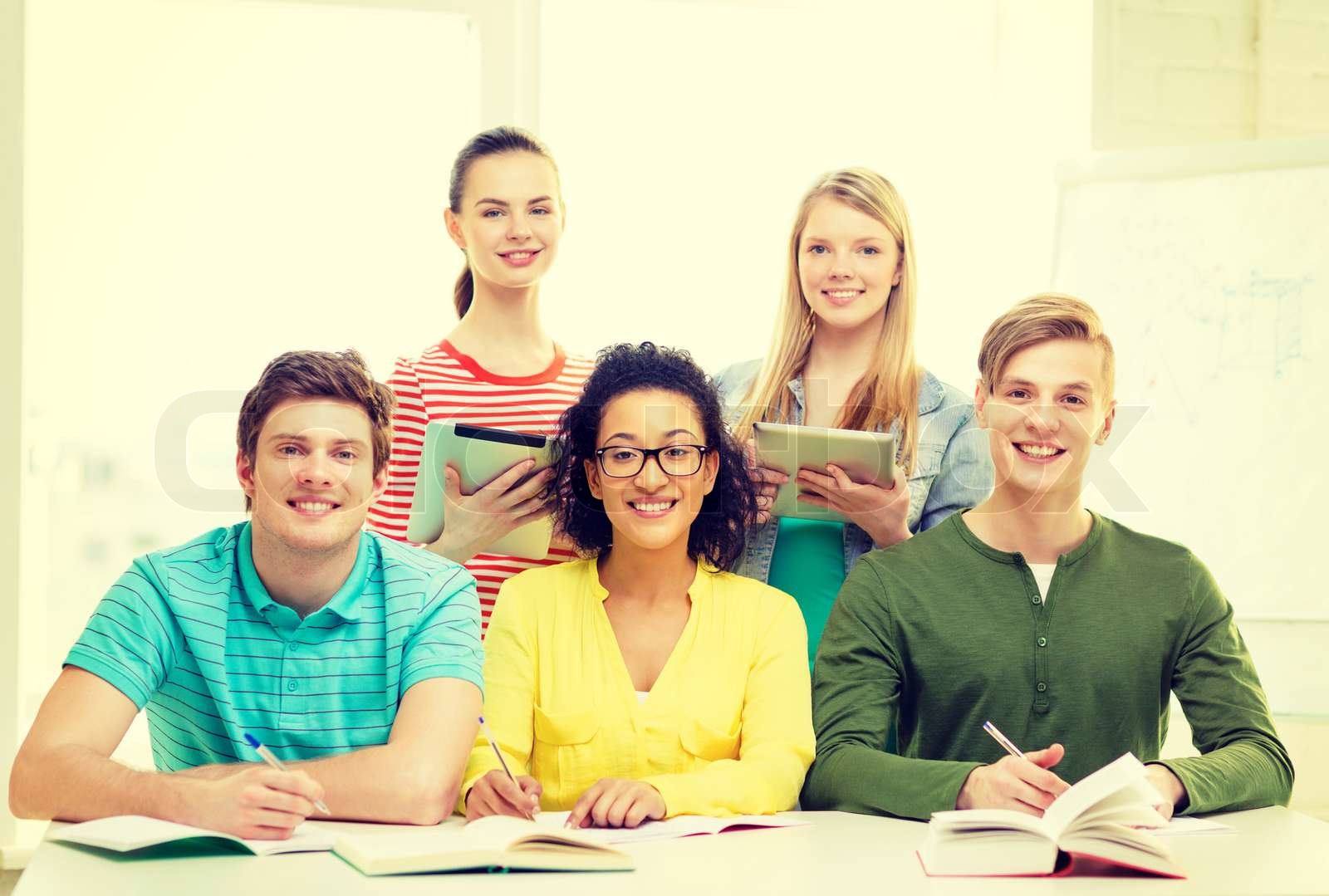 students with textbooks and books at school | Stock image | Colourbox