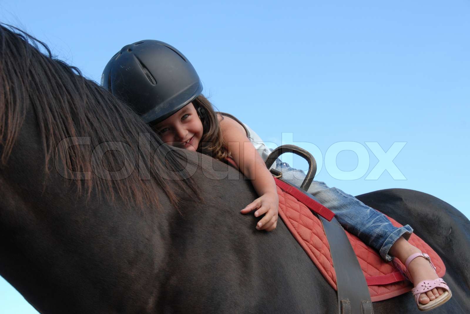 riding little girl | Stock image | Colourbox