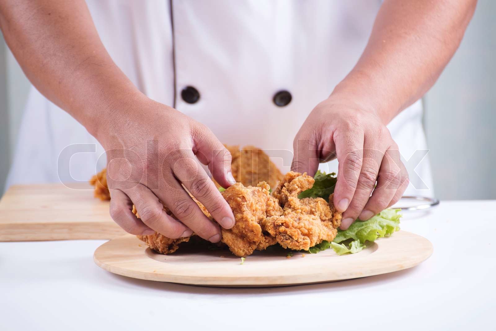 chef cook preparing fried chicken | Stock image | Colourbox
