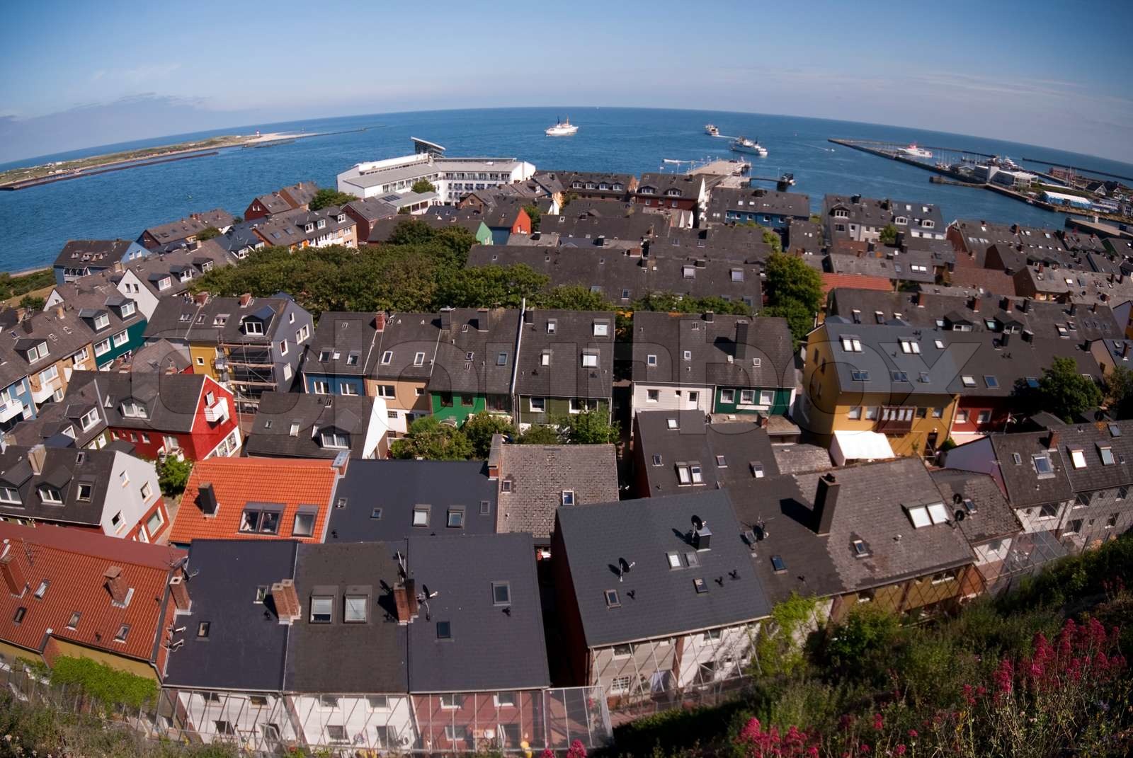 Helgoland Island view from above. Unterland houses and ferry sercice in ...