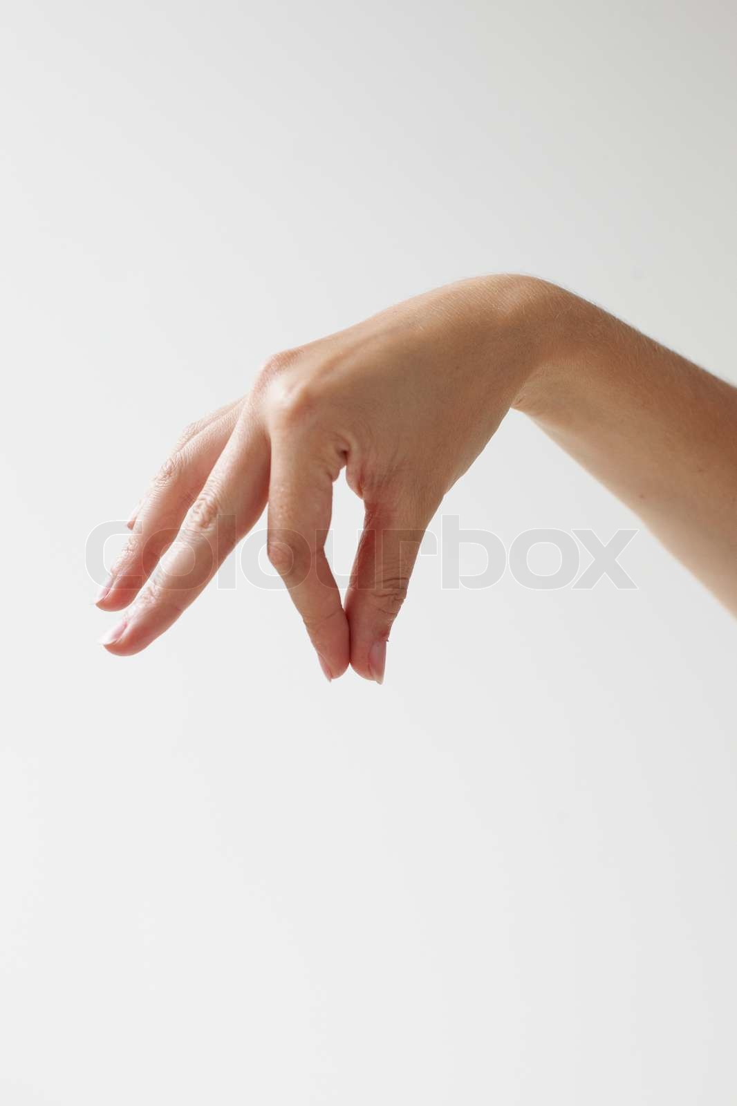 Hand gesturing sign language - picking something | Stock image | Colourbox