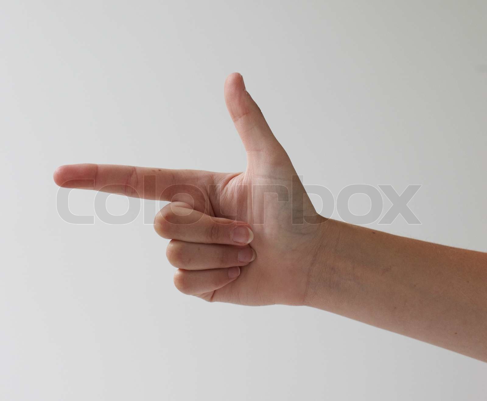 Hand gesturing sign language - firing a gun | Stock image | Colourbox