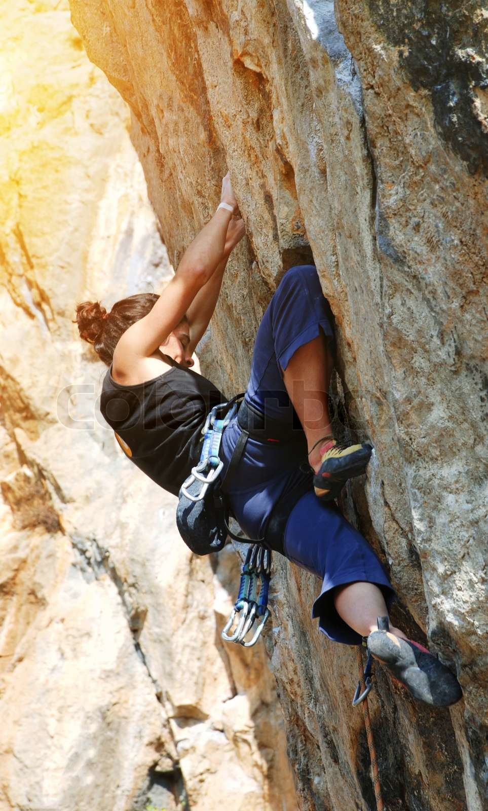 The rock-climber during rock conquest | Stock image | Colourbox