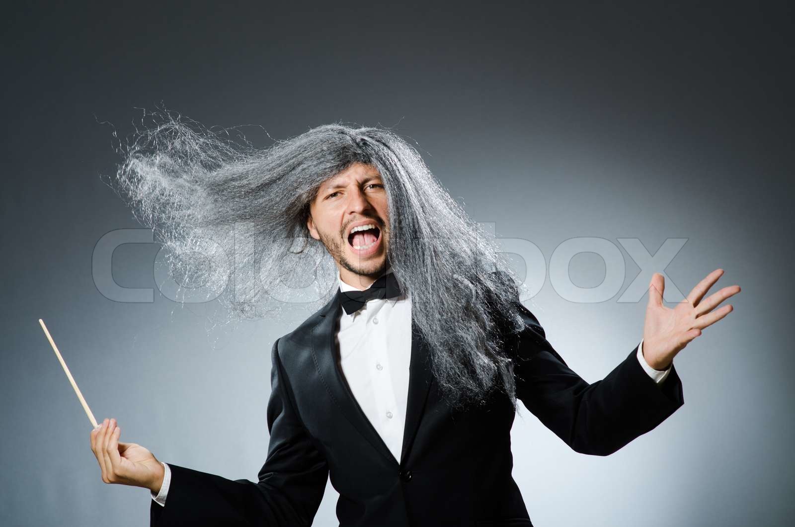 Funny conductor with long grey hair | Stock image | Colourbox