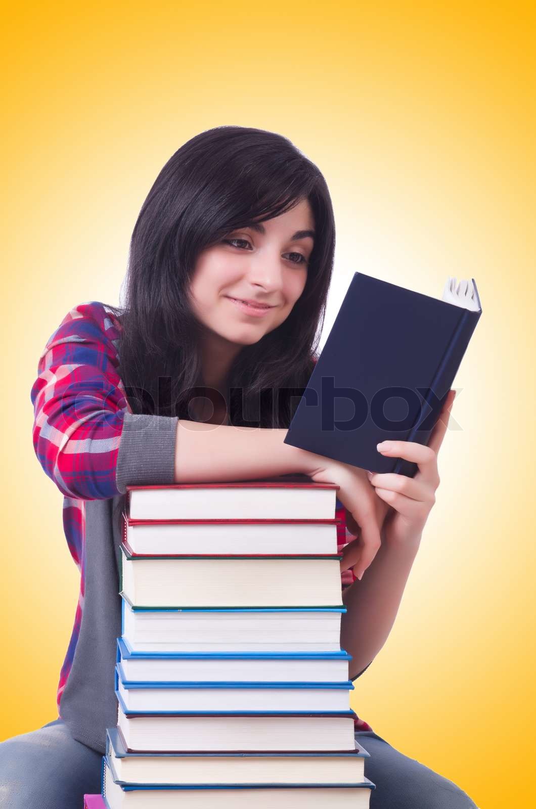 Girl student with books on white | Stock image | Colourbox