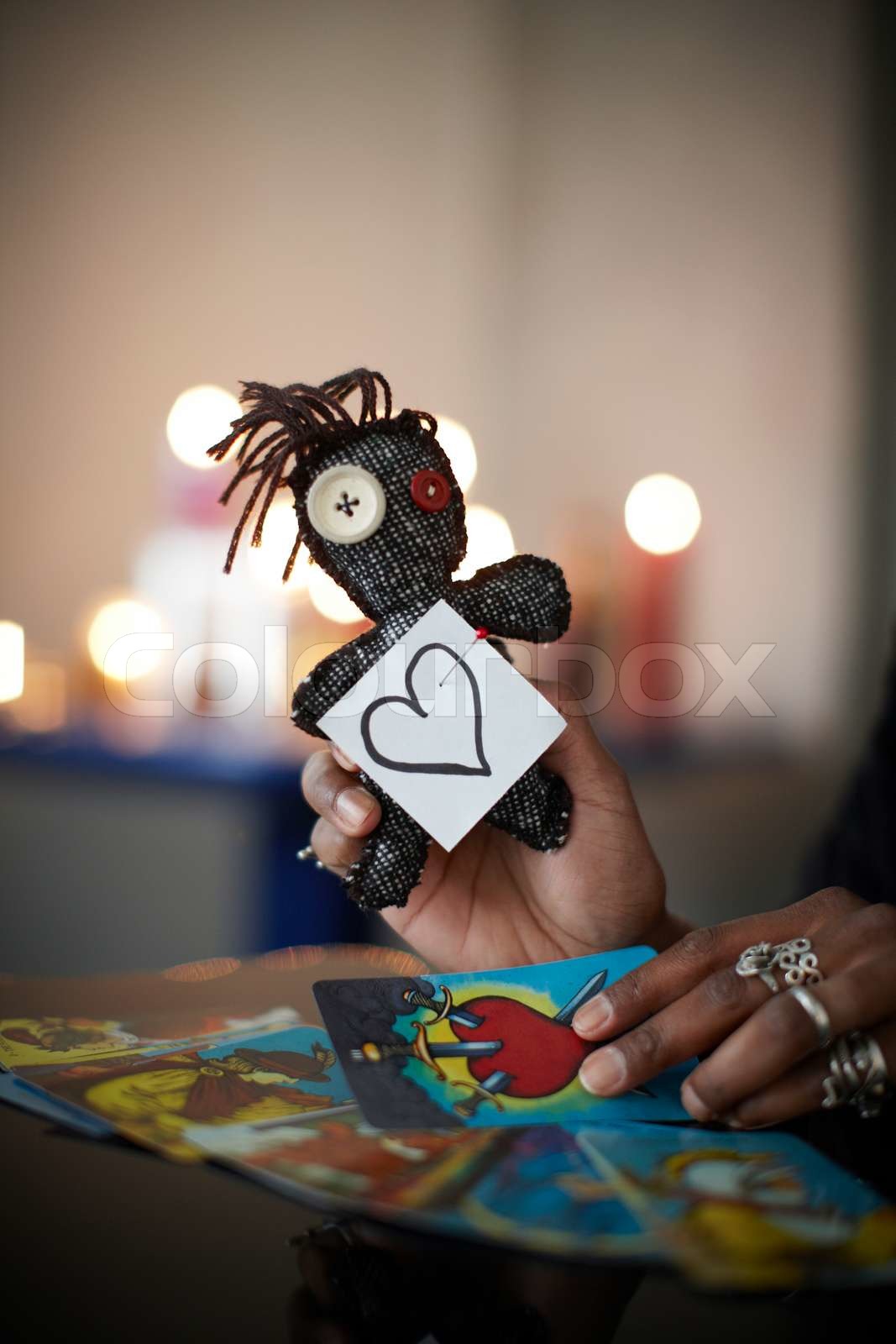 A female witch with a voodoo doll doing black magic | Stock image ...