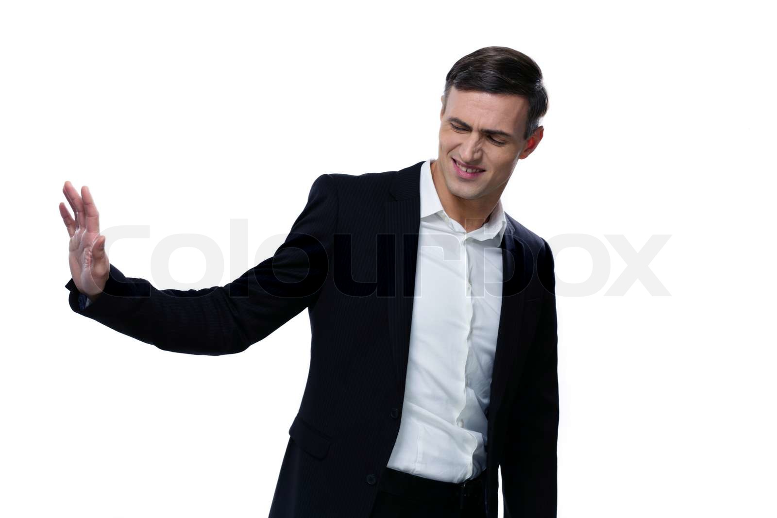 Businessman expressing refusal with open hand | Stock image | Colourbox