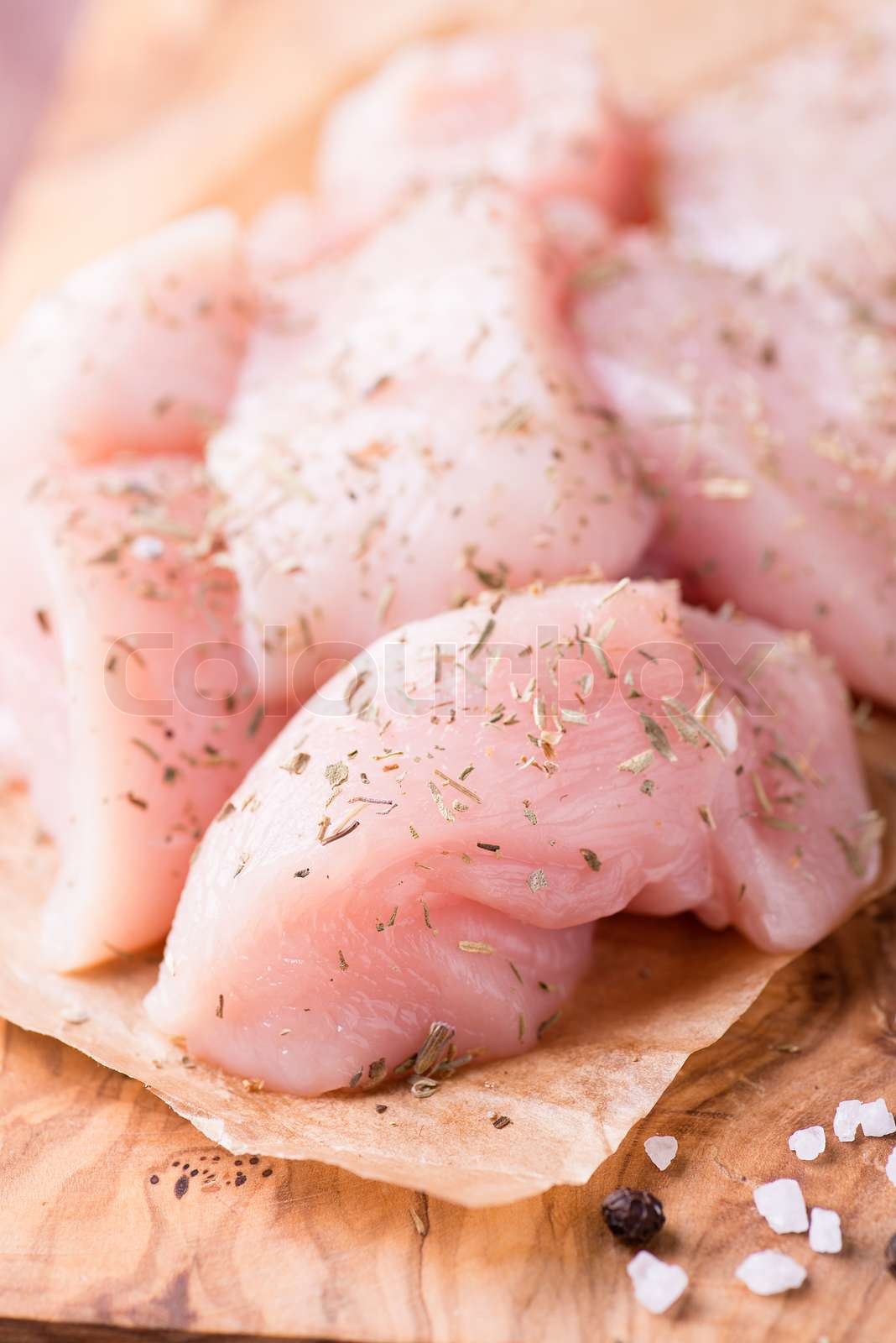 Seasoned raw chicken breast fillets | Stock image | Colourbox