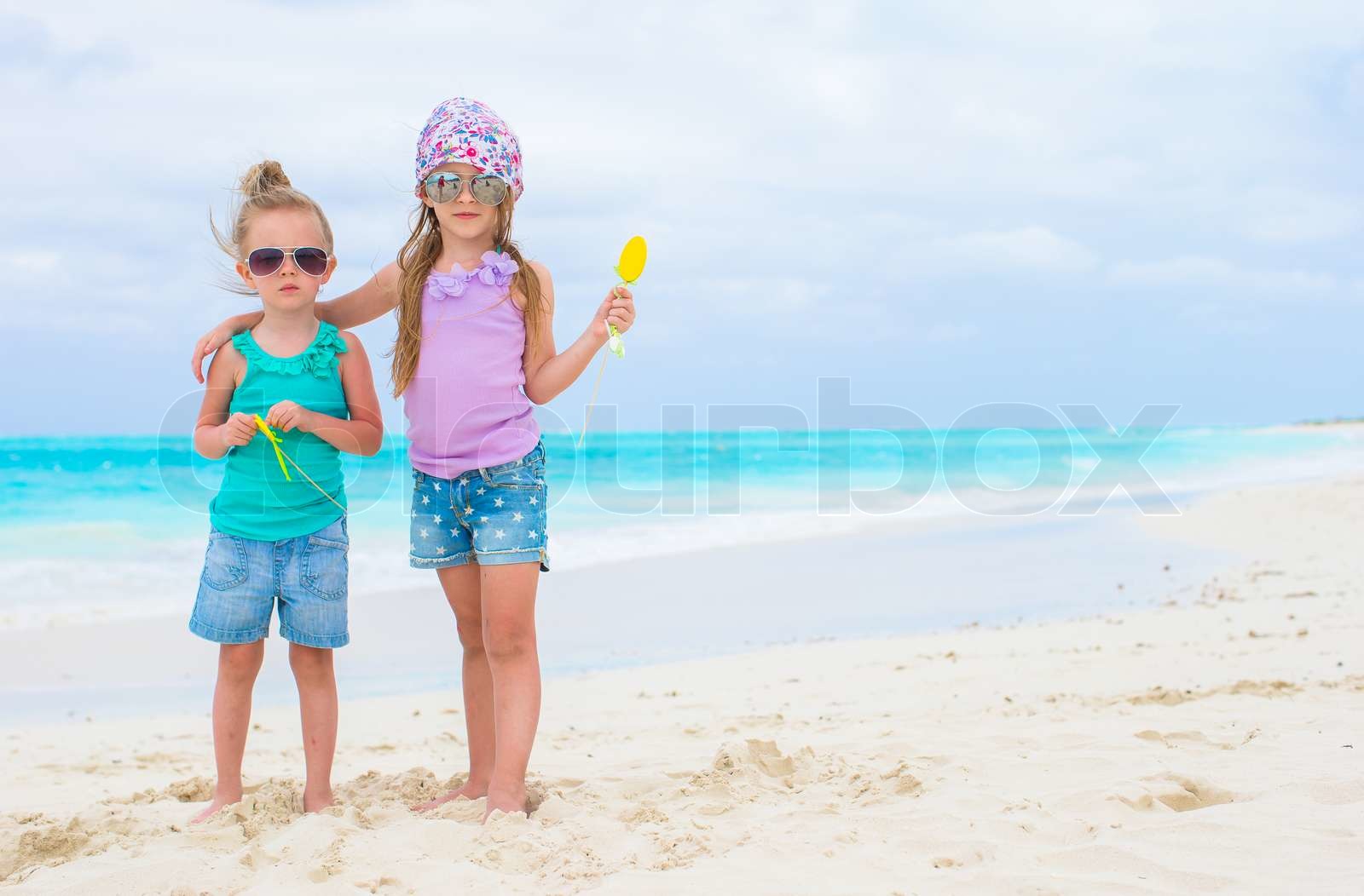 Little adorable girls during tropical beach vacation | Stock image ...