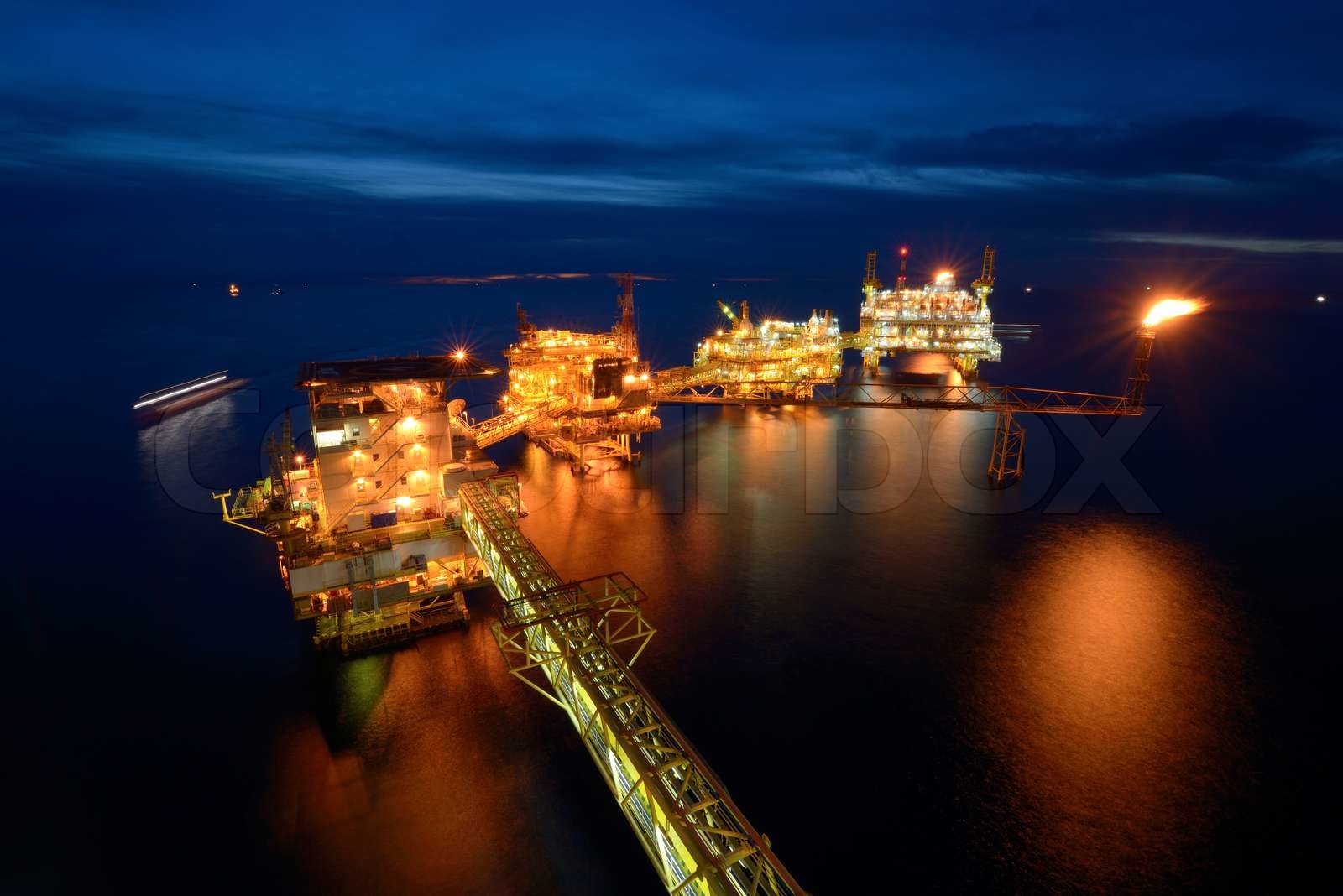 The large offshore oil rig platform at night | Stock image | Colourbox