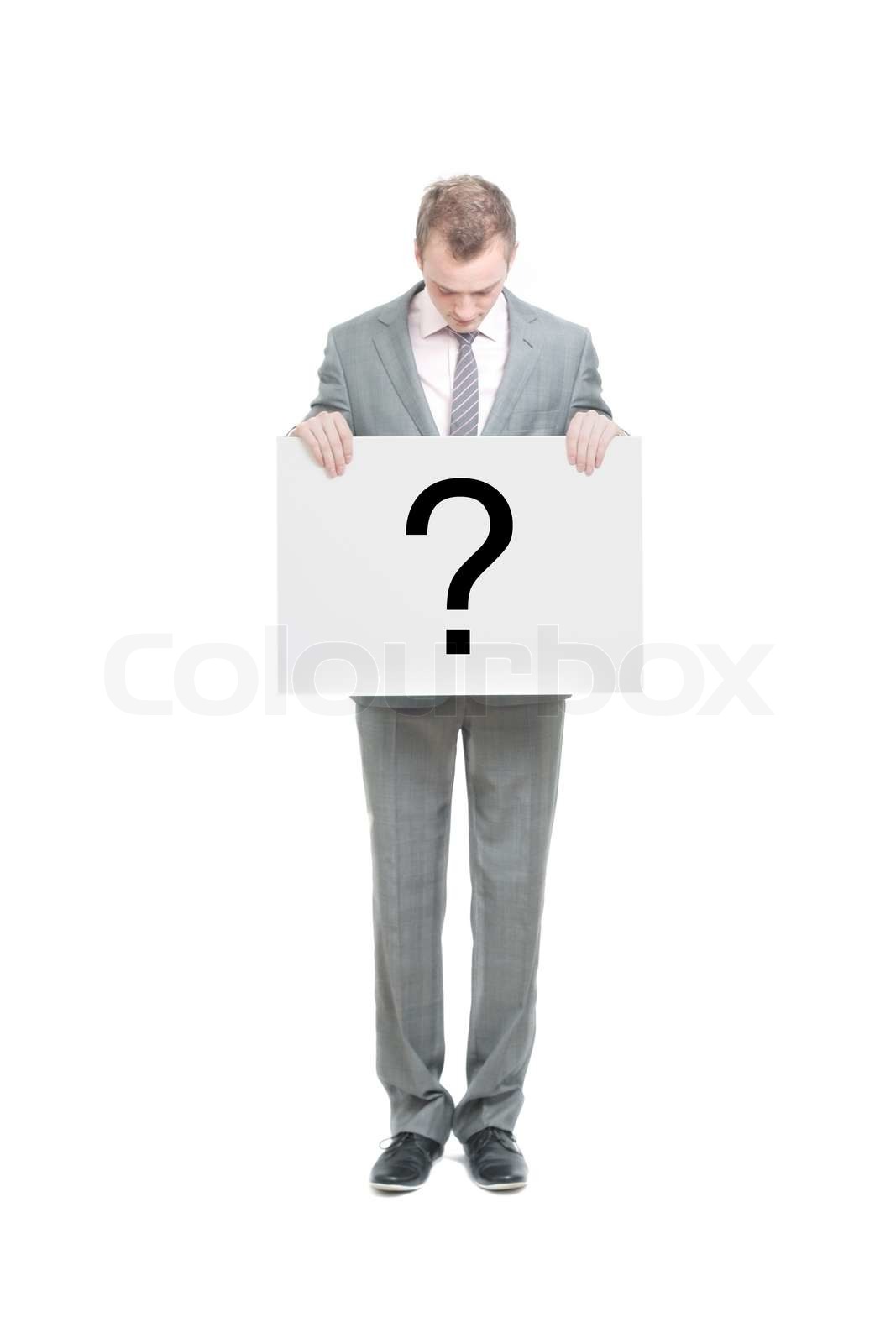 A business man holding a question mark | Stock image | Colourbox