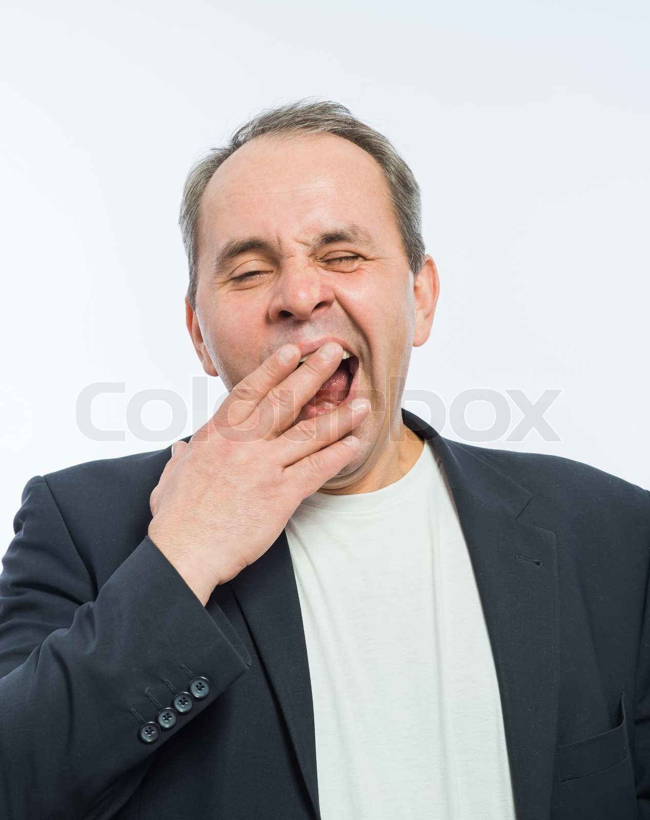 Businessman yawn boring | Stock image | Colourbox