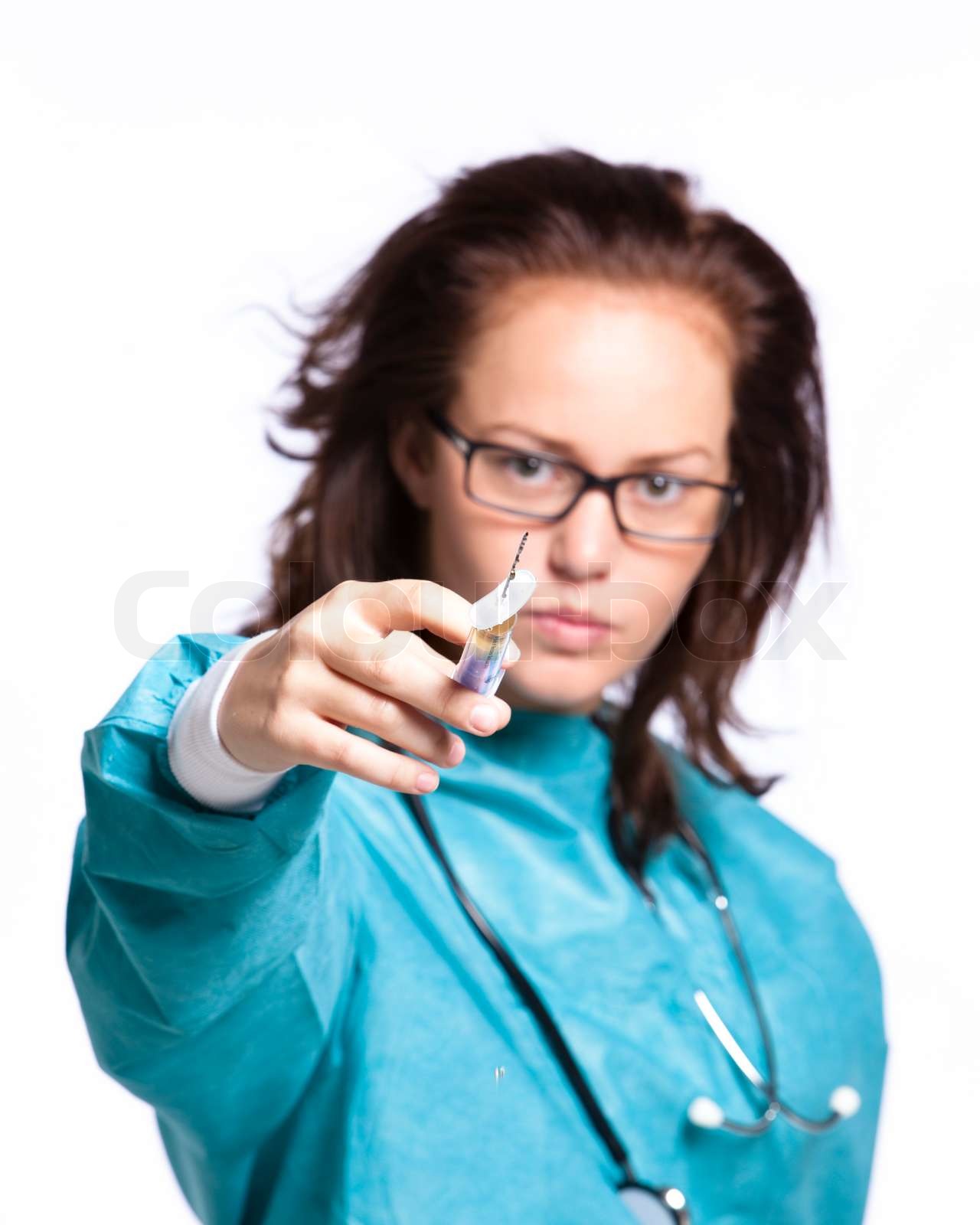 Female doctor with a injection | Stock image | Colourbox