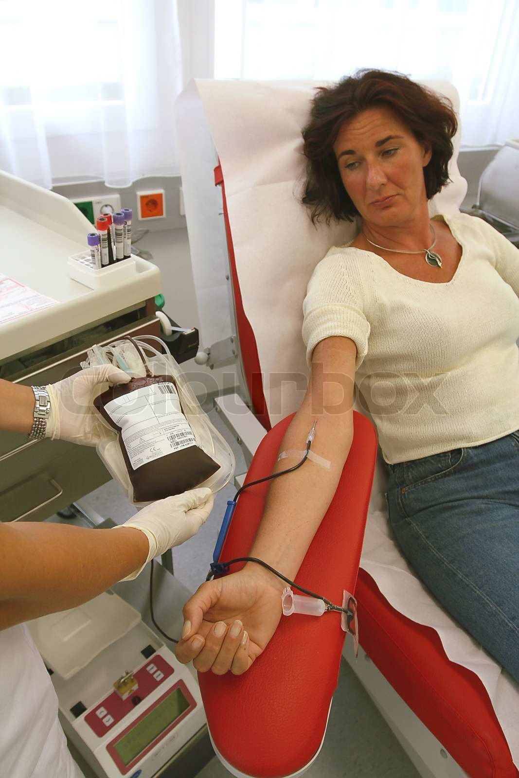 Woman at the blood donation in a blood laboratory | Stock image | Colourbox