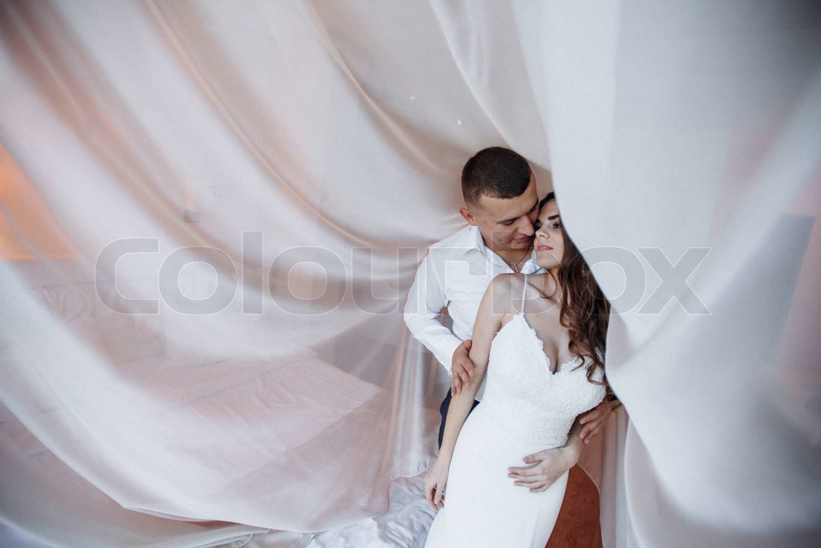 Wedding couple in hotel room | Stock image | Colourbox