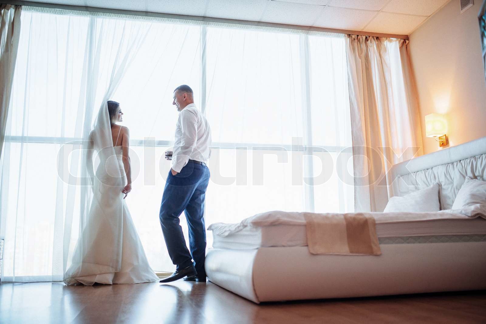 Wedding couple in hotel room | Stock image | Colourbox