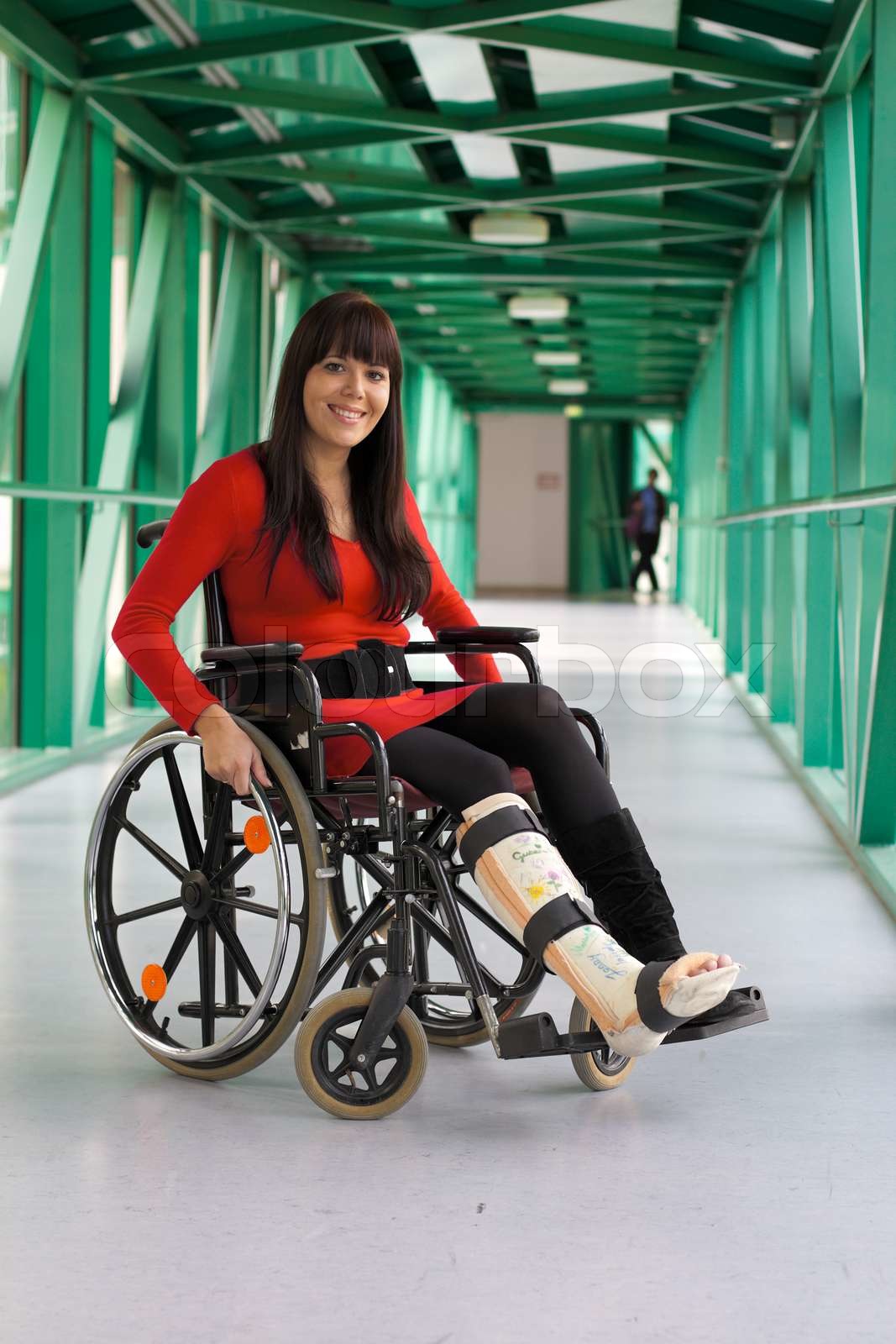 Young woman with a leg cast and wheelchair in the hospital | Stock ...