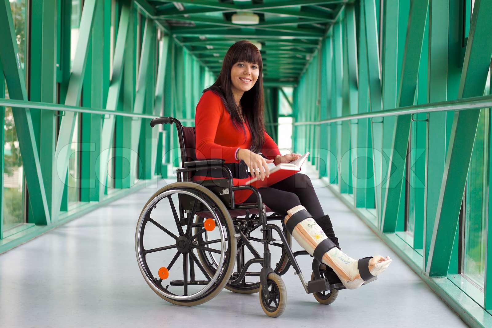 Young woman with a leg cast and wheelchair in the hospital | Stock ...