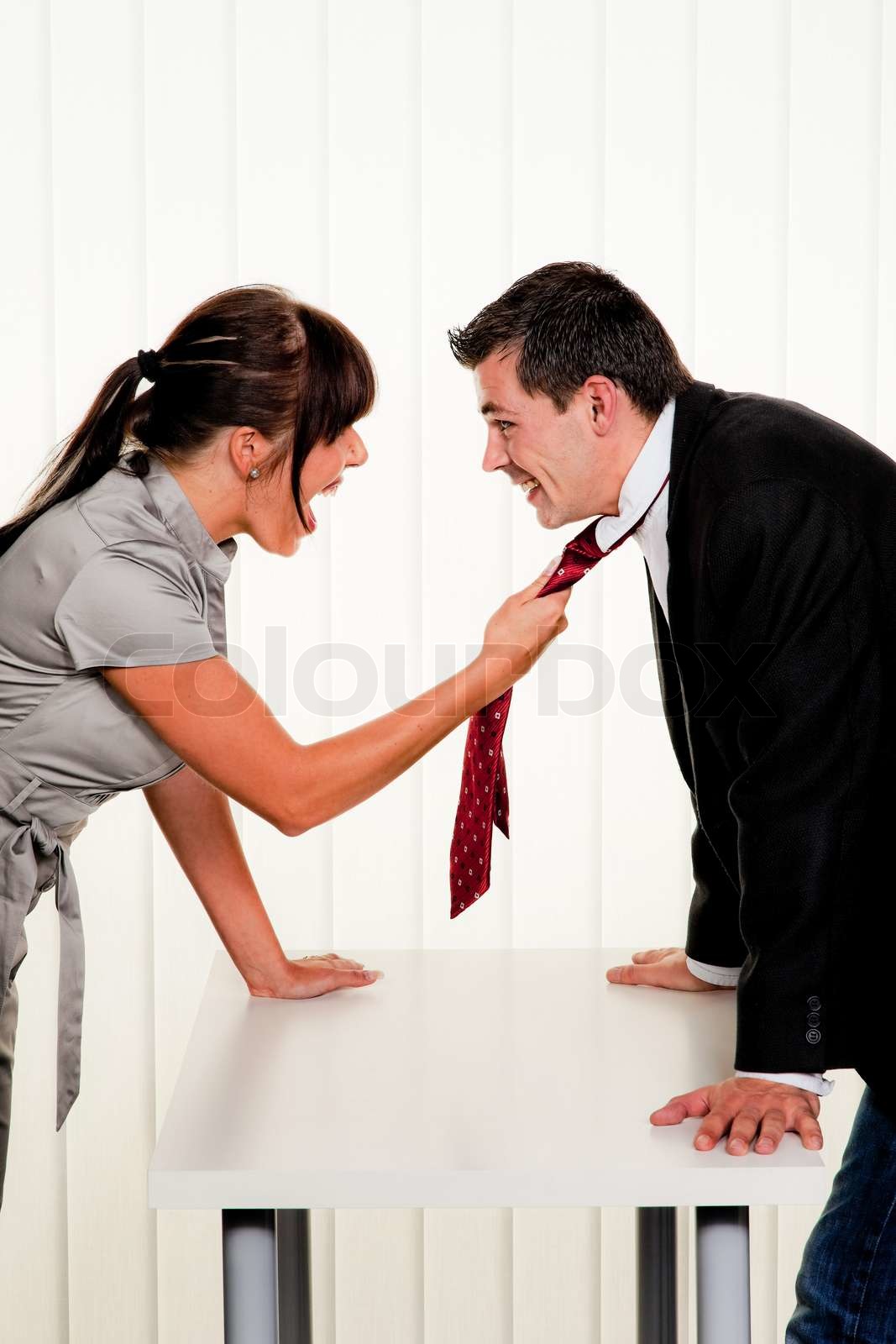 Dispute among employees at work in an office | Stock image | Colourbox