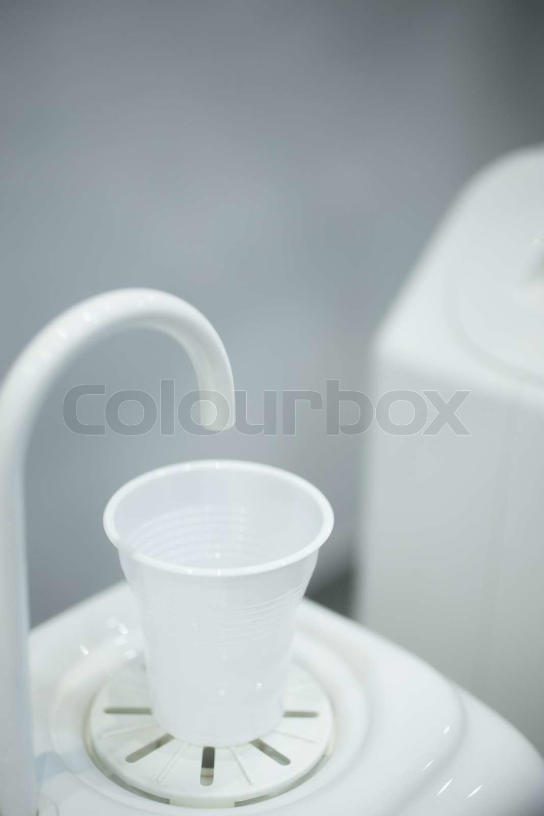 Dentist water cup tap filler in dental clinic | Stock image | Colourbox