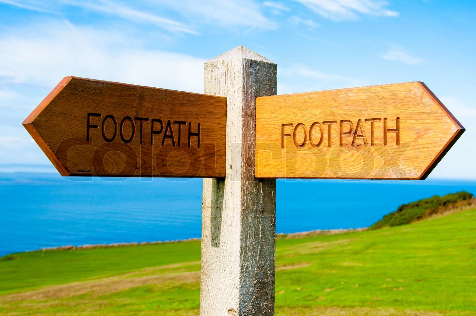 Footpath direction sign in English countryside | Stock image | Colourbox