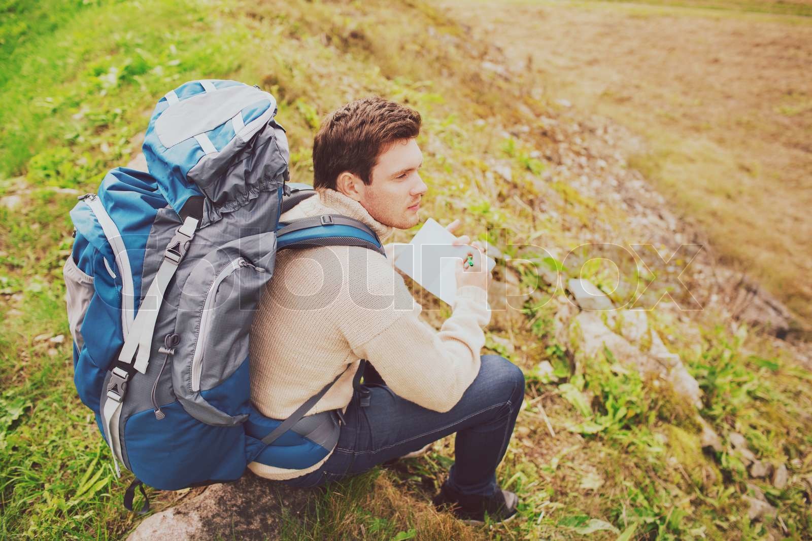 man with backpack hiking | Stock image | Colourbox