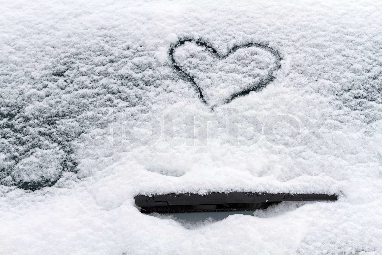 Heart symbol on a car windshield. | Stock image | Colourbox