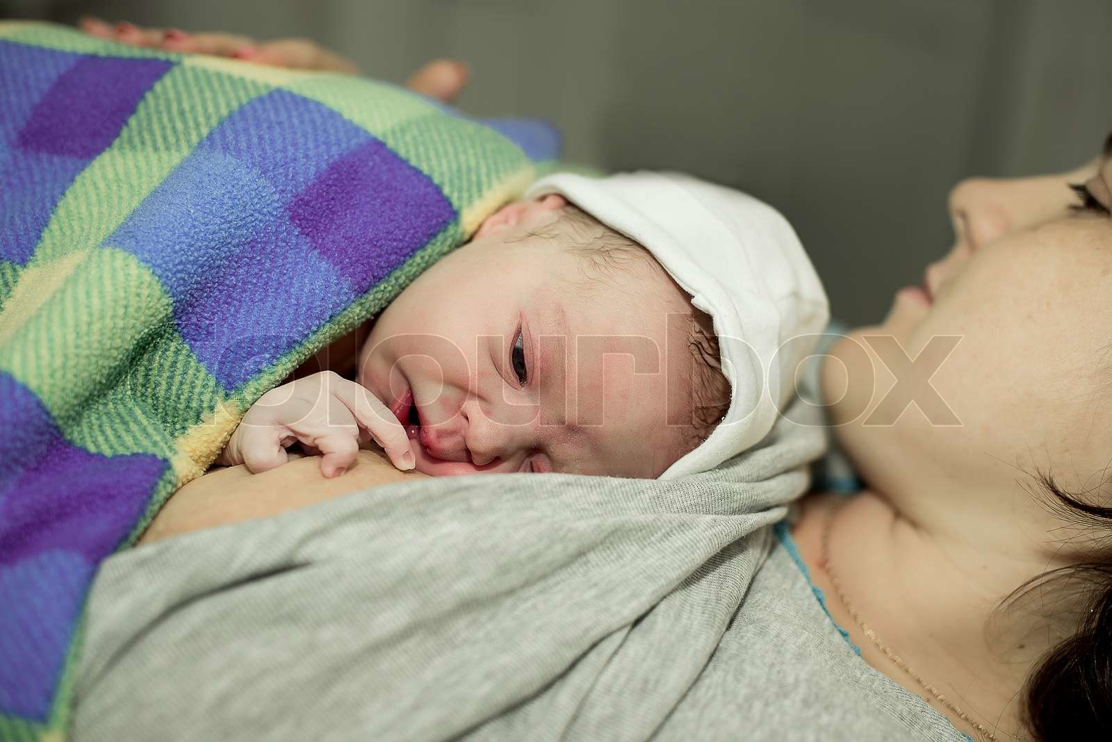 happy woman after birth with a newborn baby | Stock image | Colourbox