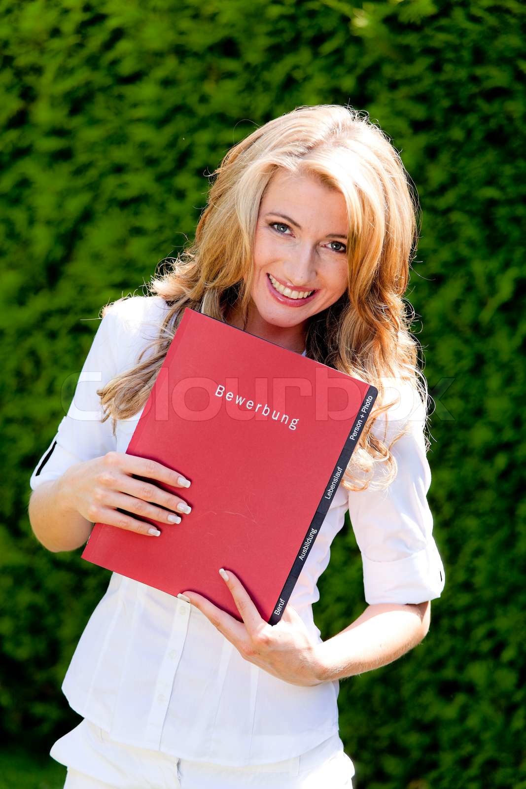 Young woman with a job application for work | Stock image | Colourbox