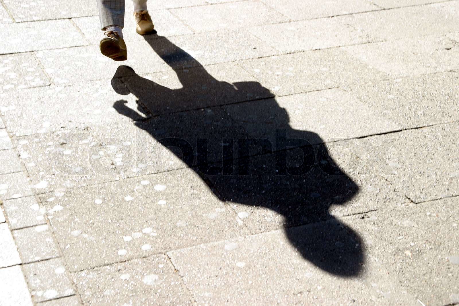 Shadow of an anonymous person | Stock image | Colourbox