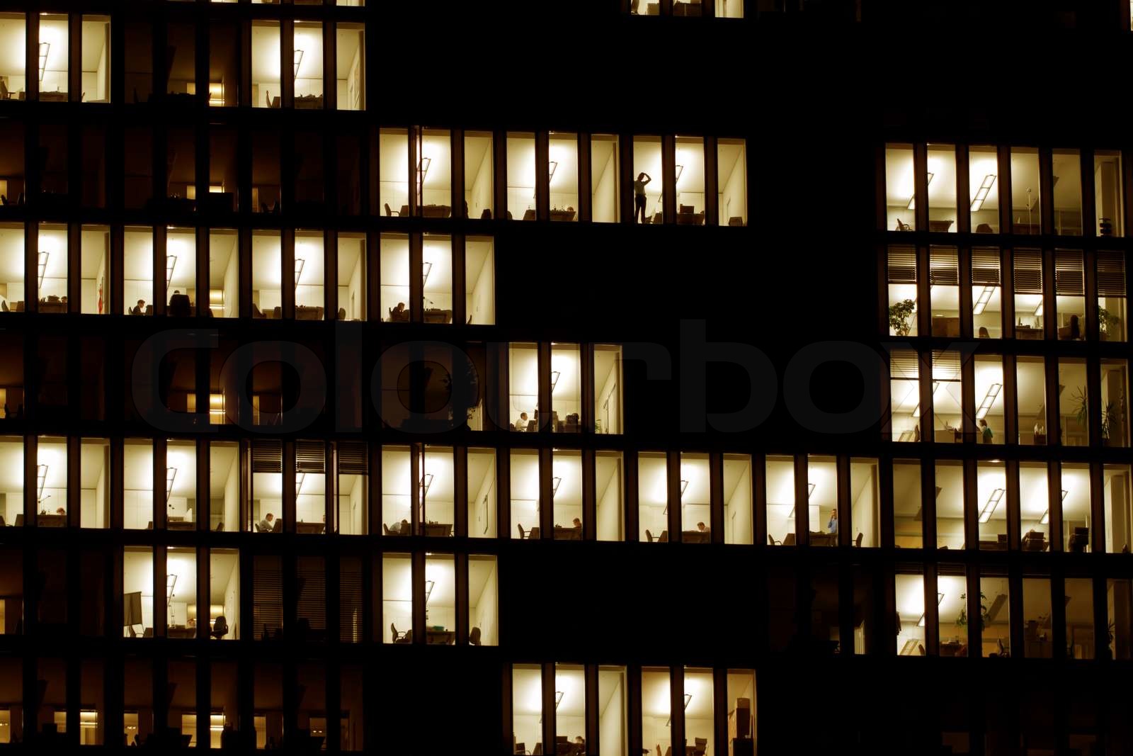 The lighted windows of an office building. Power and energy | Stock ...