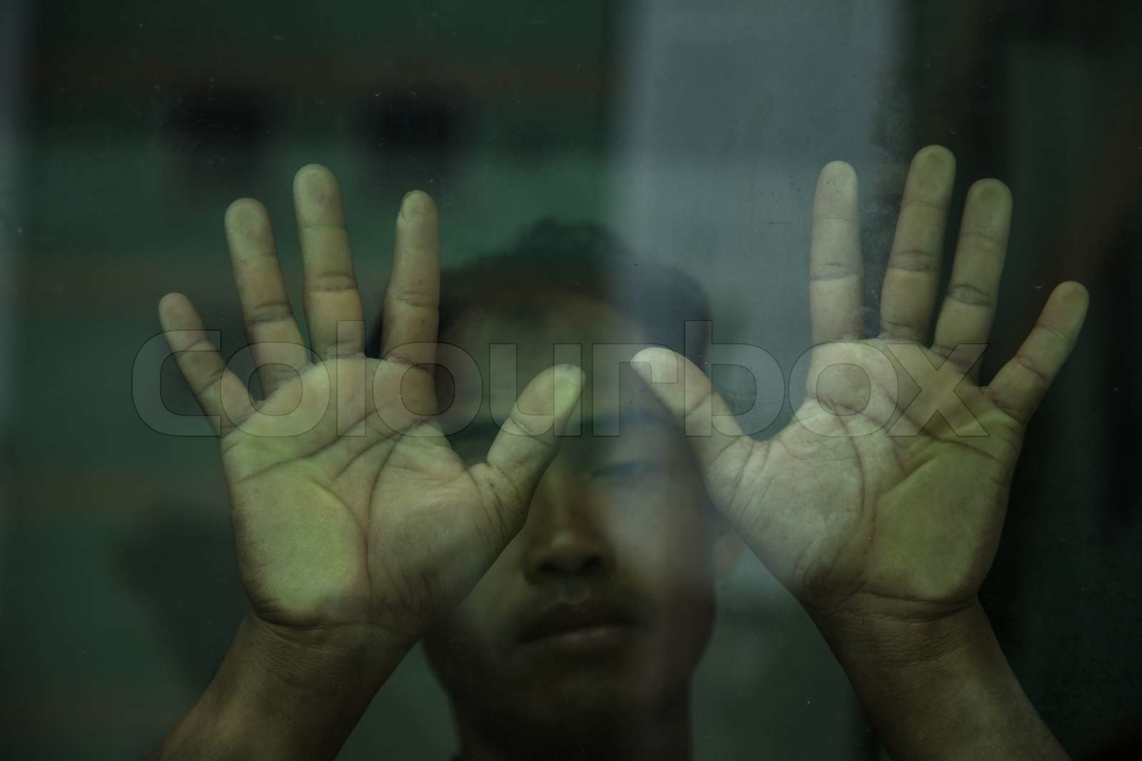 Man behind the glass | Stock image | Colourbox