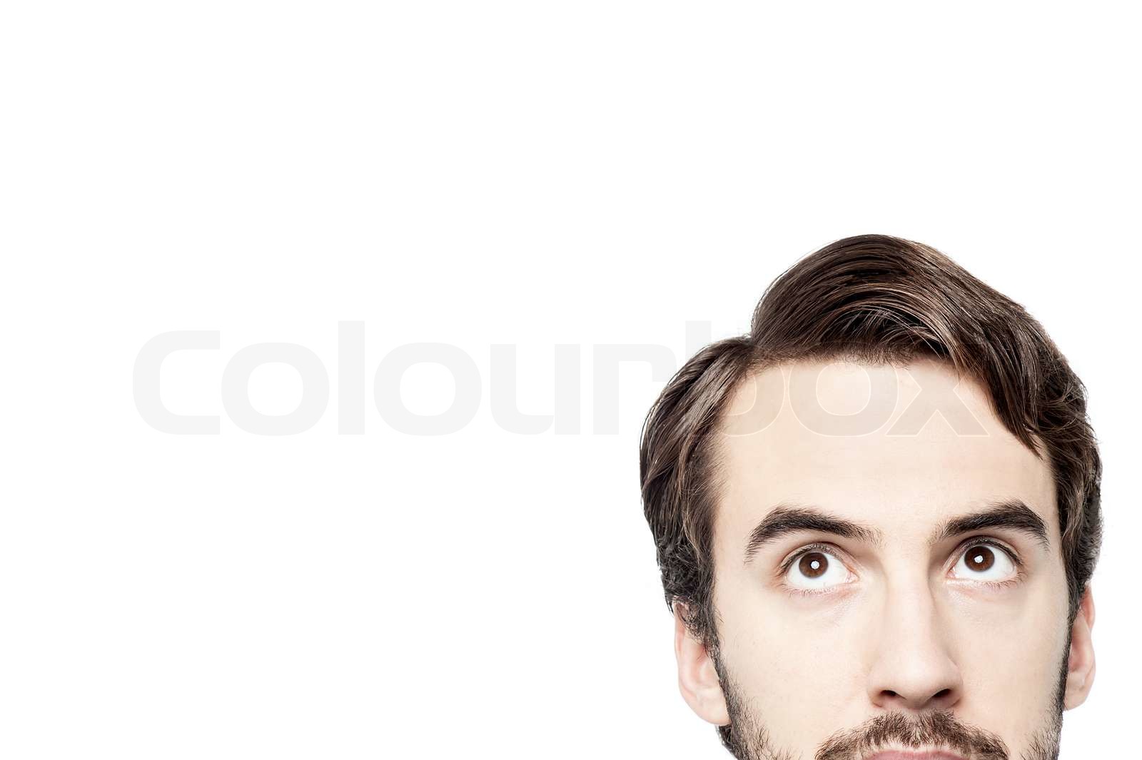 Cropped image of young man looking up | Stock image | Colourbox